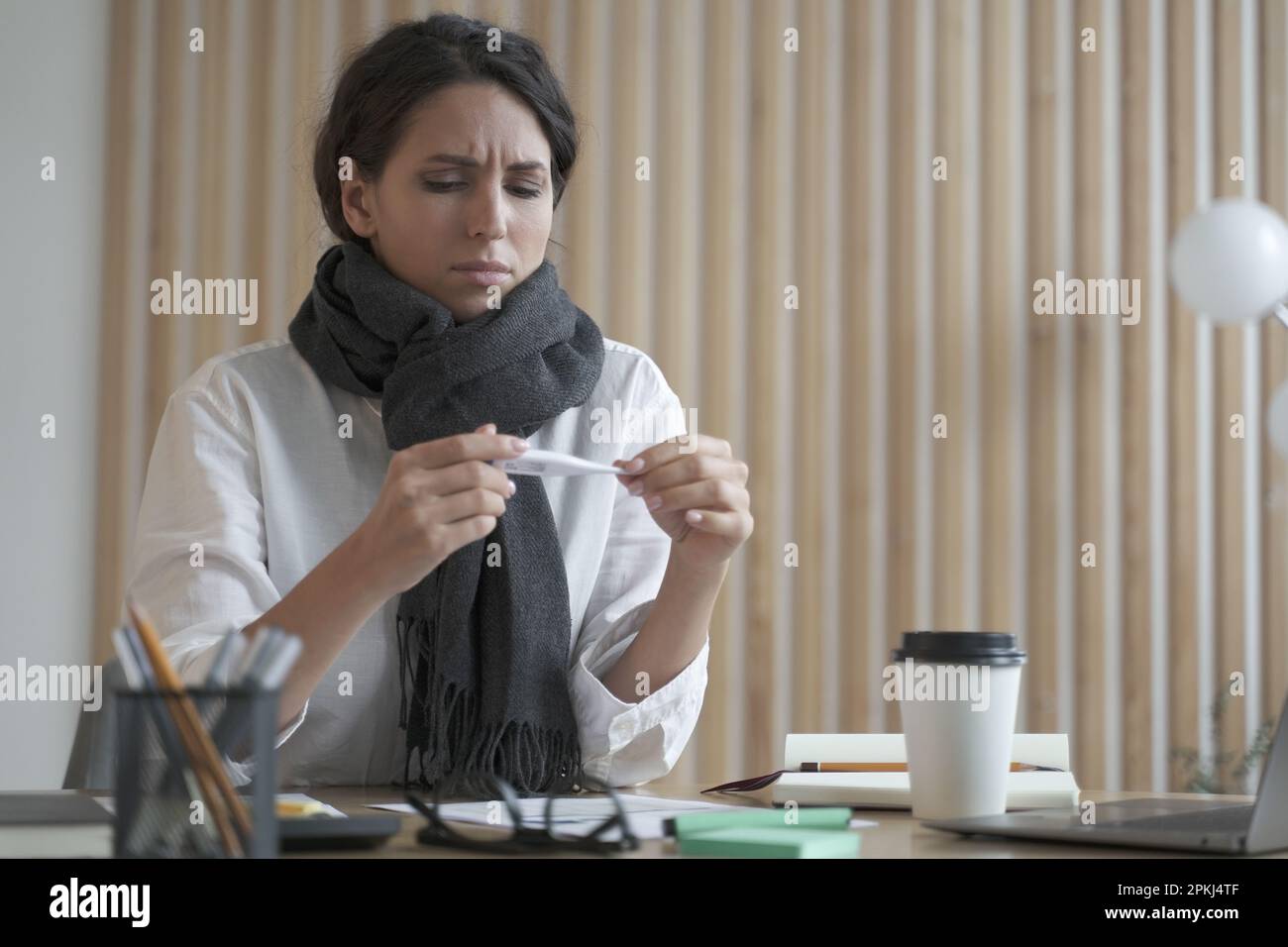 Unhealthy young hispanic business woman wearing scarf around neck ...