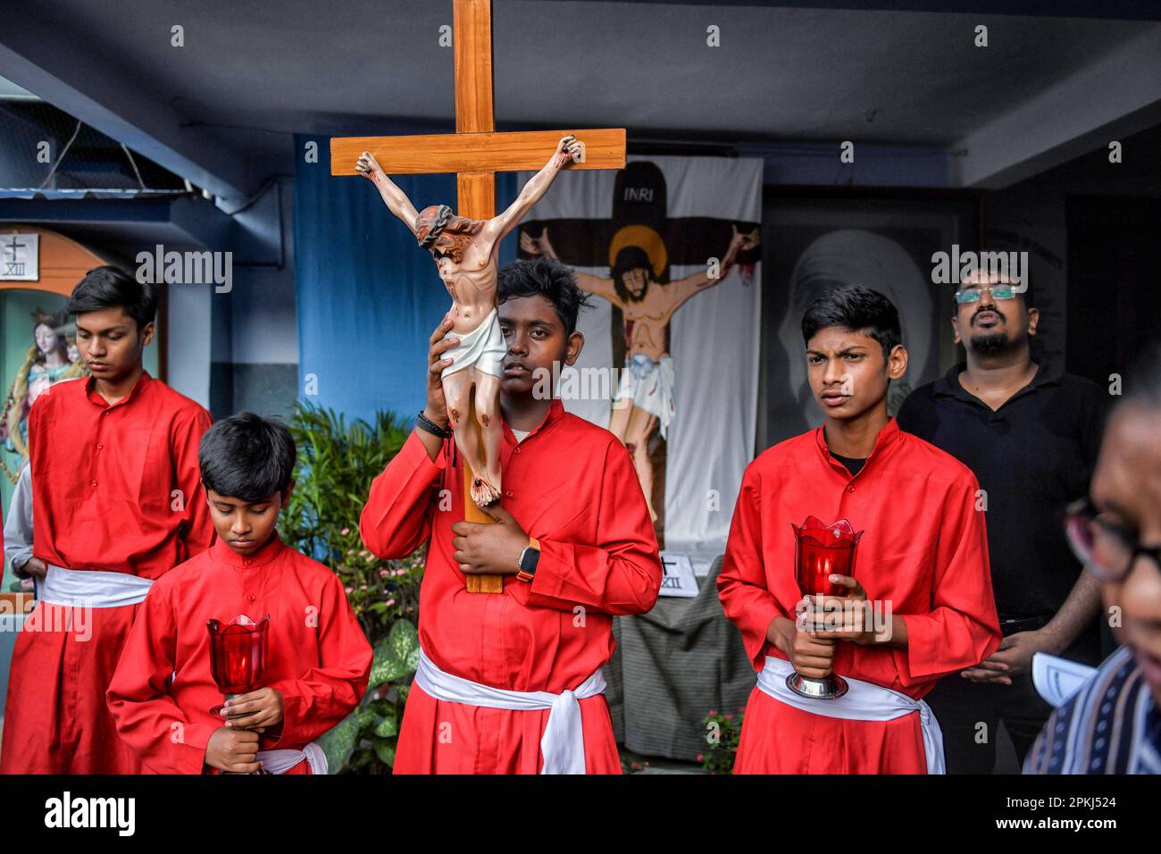 Kolkata, India. 07th Apr, 2023. Young devotees carry a cross as they take part in the religious ...