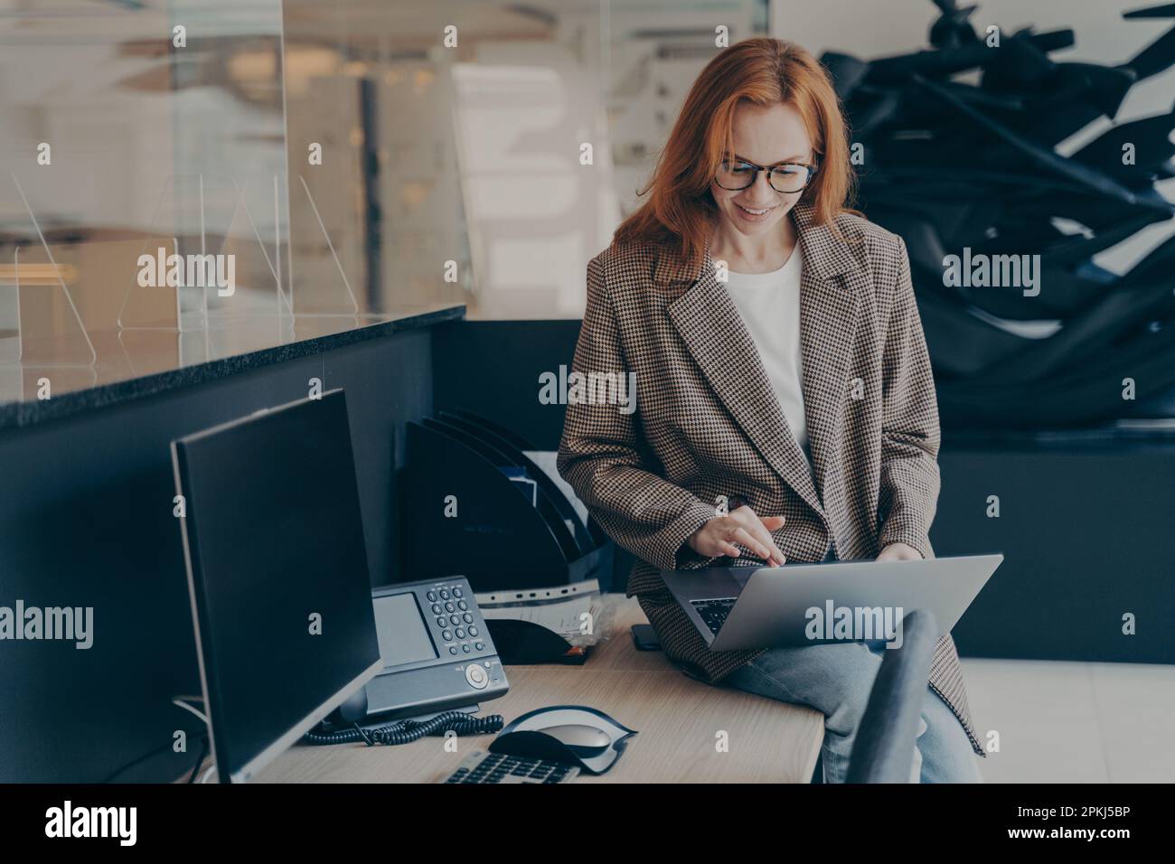Female office worker in eyeglasses, wearing casual plaid jacket with ...