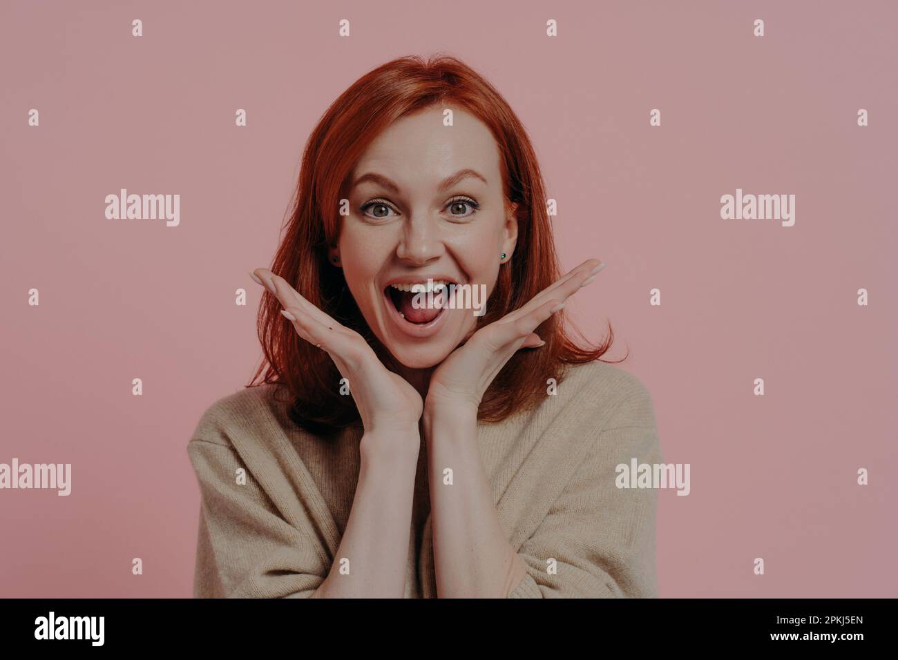 Wow Portrait Of Young Surprised Beautiful Ginger Woman Spreading Palms