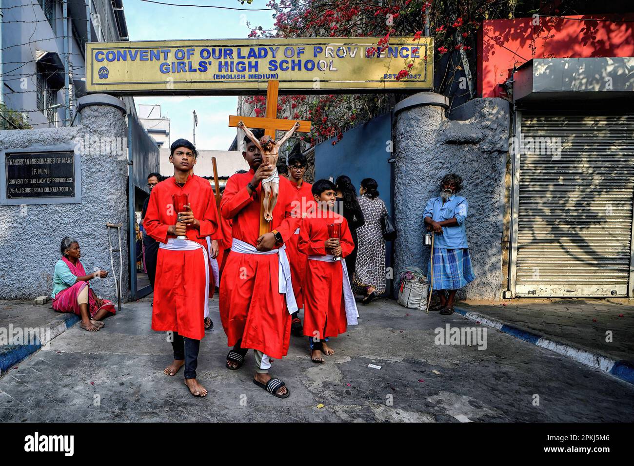 Kolkata, India. 07th Apr, 2023. Young devotees carry a cross as they take part in the religious ...