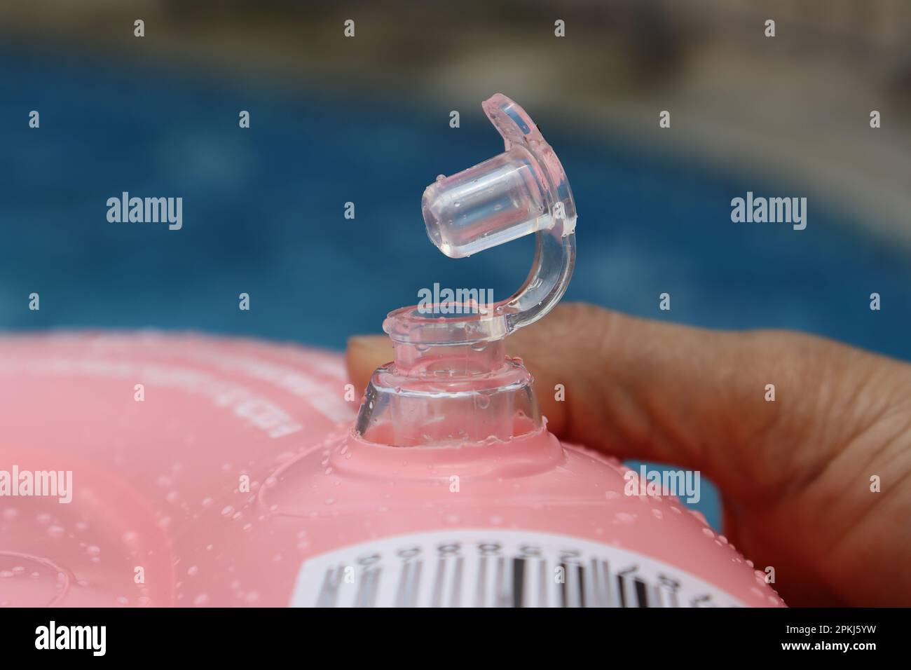 Front focus of a open inflatable valve of a swimming tube. Summer ...