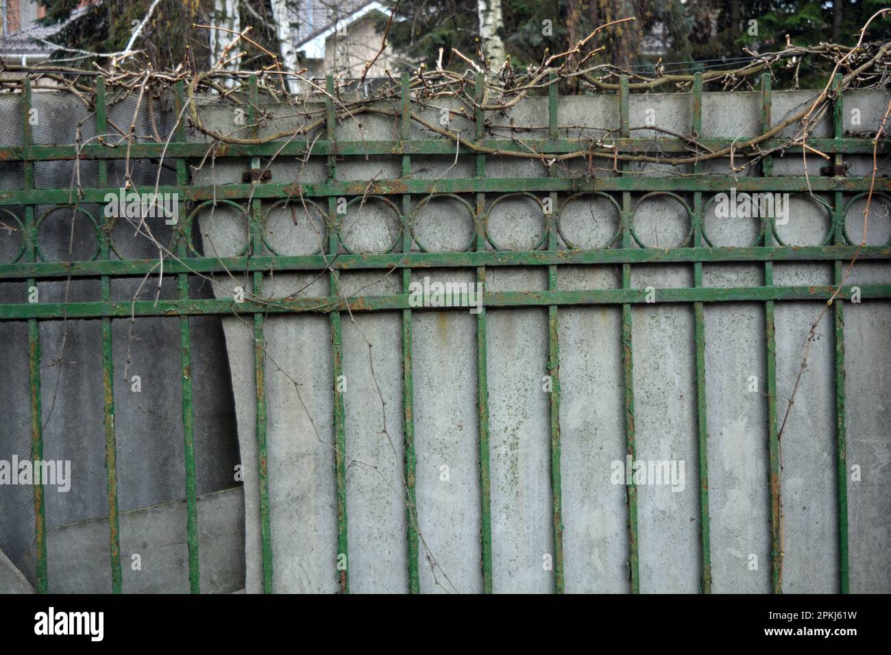 An old forged, metal fence with peaks, pins, rings from Soviet times ...