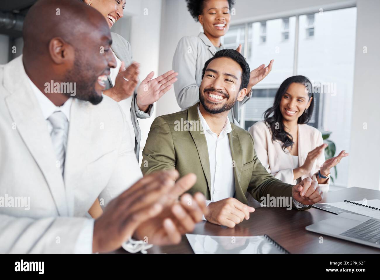 Clapping, laptop and business people in meeting for proposal, logo or ...