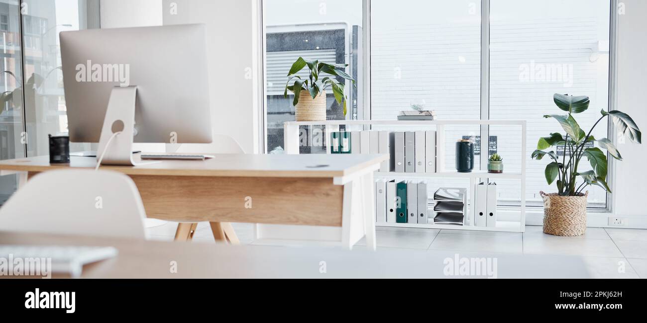 Empty office, interior and computer on desk in workplace, company or ...