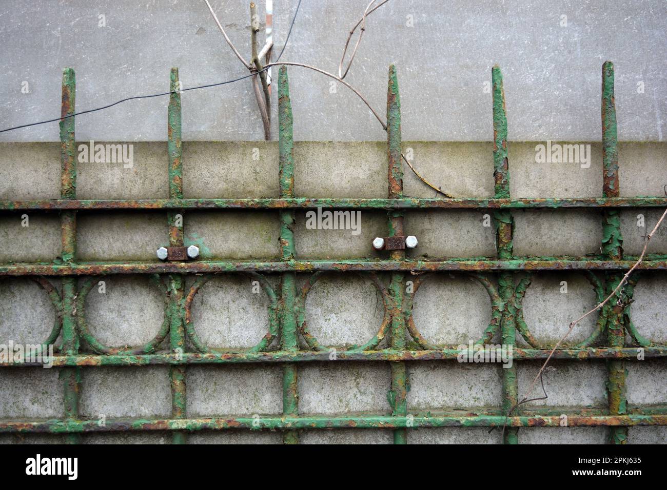 An old forged, metal fence with peaks, pins, rings from Soviet times ...