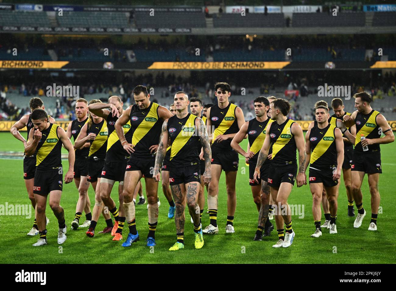 Richmond Tigers players leave the field following the AFL Round 4 match ...