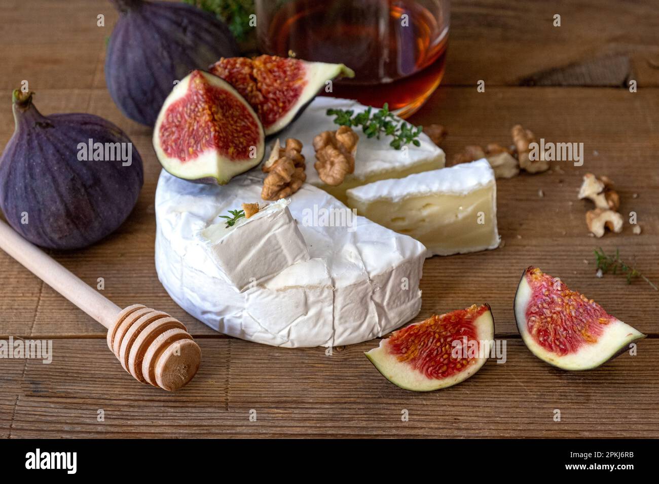 Cheese camembert with nuts , honey figs Stock Photo - Alamy