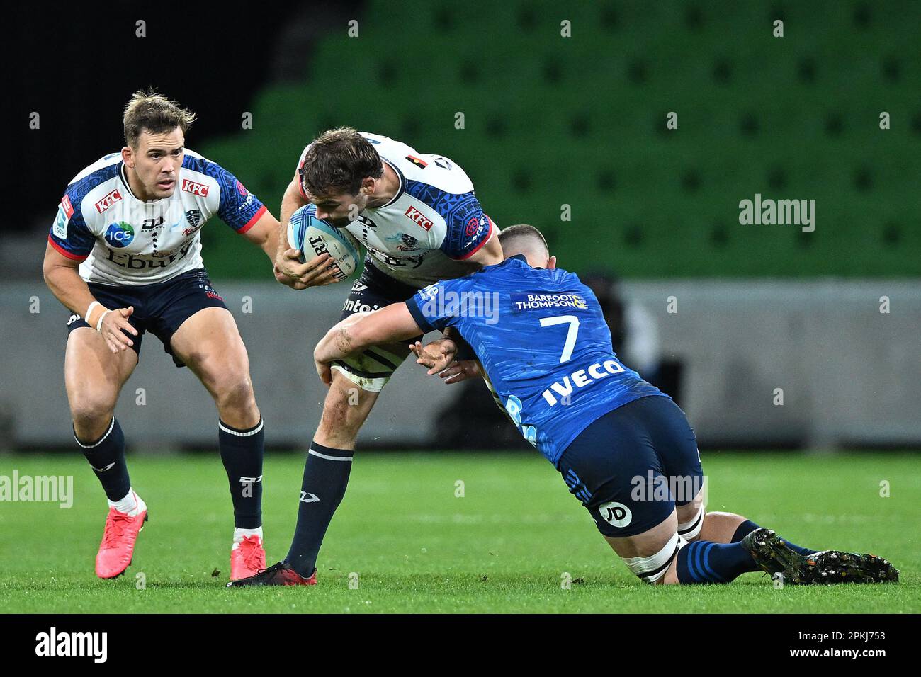 Josh Kemeny of the Rebels (centre) is tackled by Dalton Papali'i of the ...