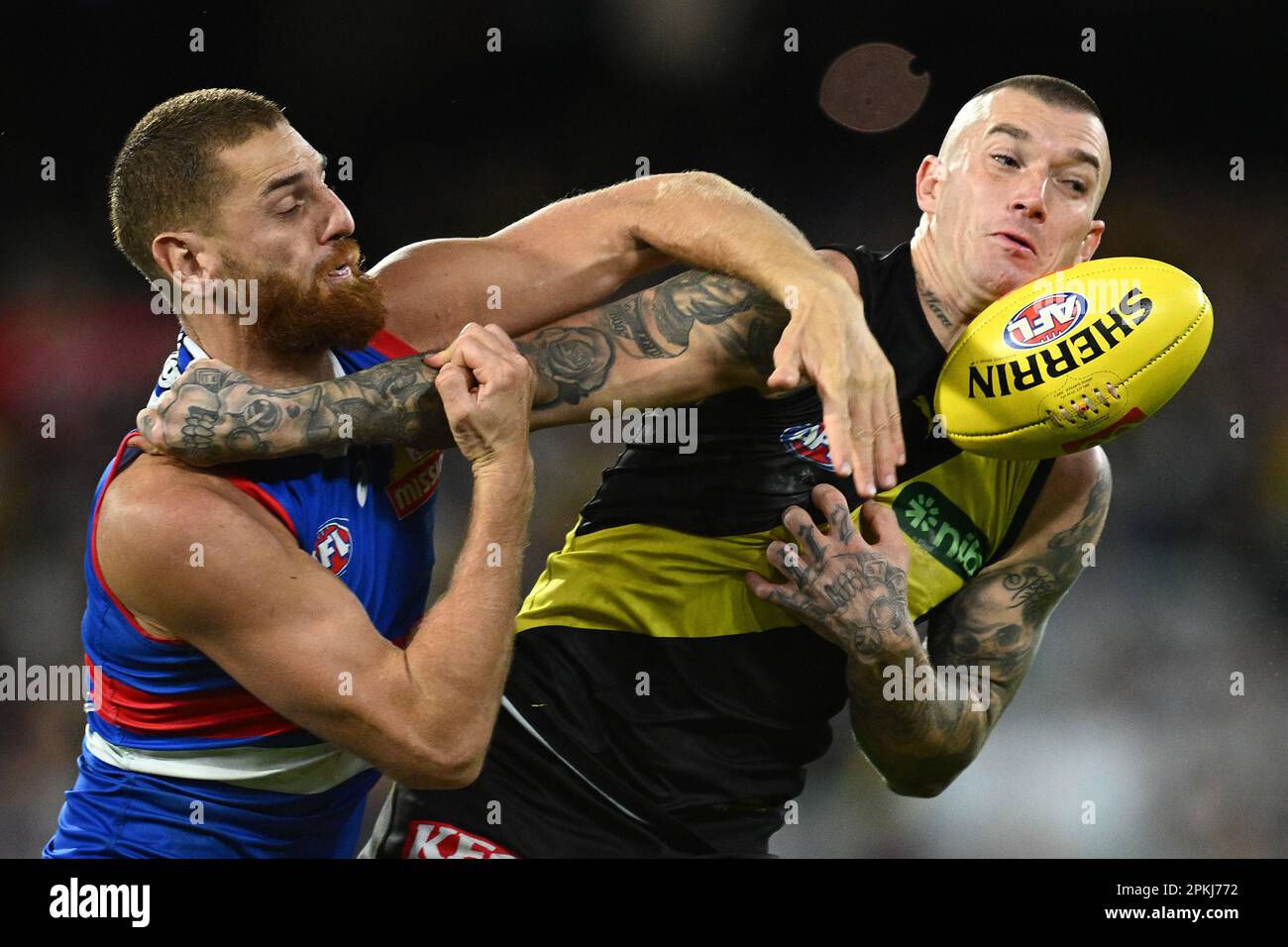 Liam Jones of Western Bulldogs (left) and Dustin Martin of Richmond ...