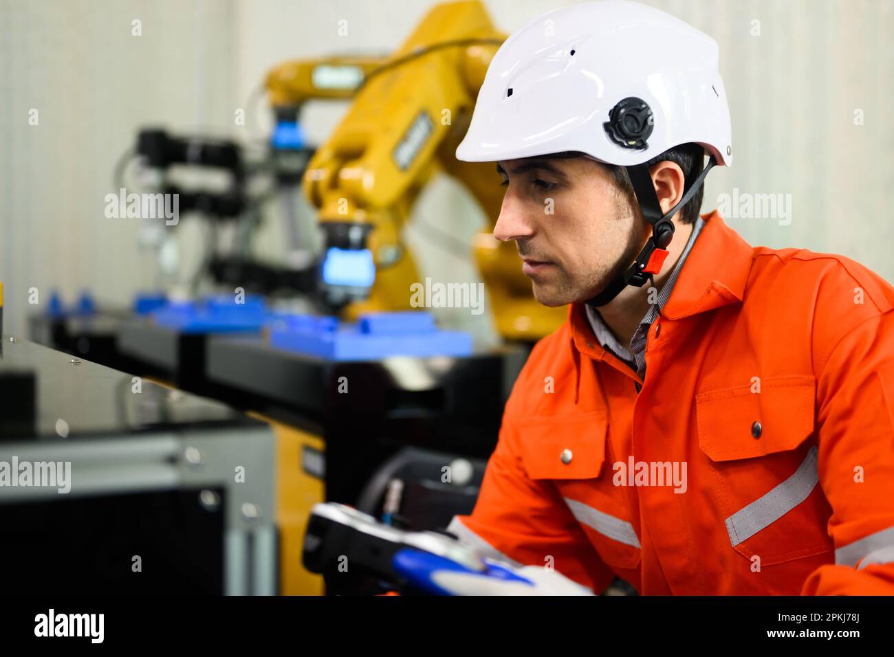 Robotics controller engineer working and solving problems on machine Stock Photo - Alamy