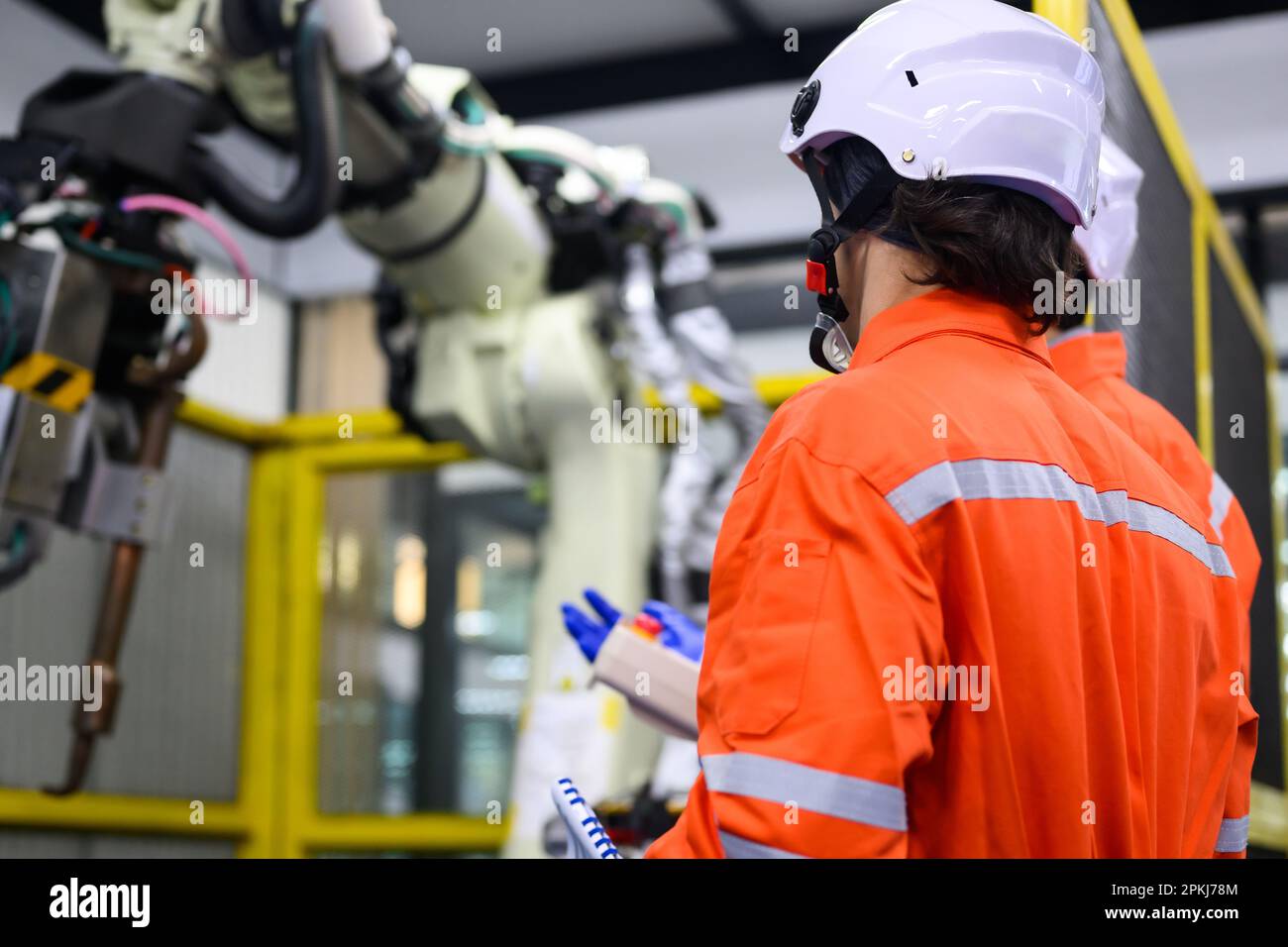 Robotics controller engineers working and solving problems on machine Stock Photo - Alamy