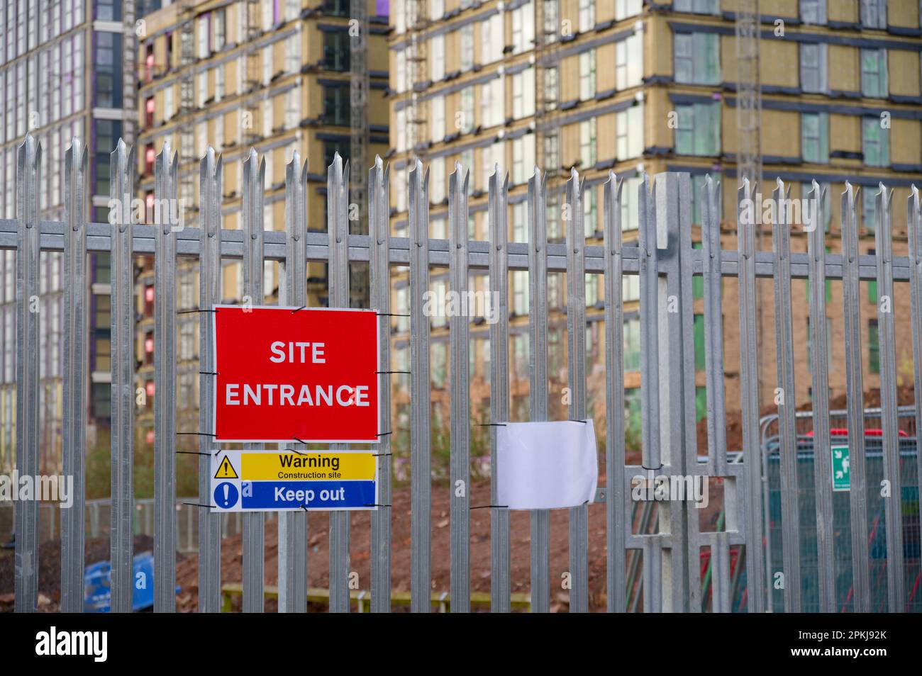 Site entrance sign on fence boundary at construction site Stock Photo ...