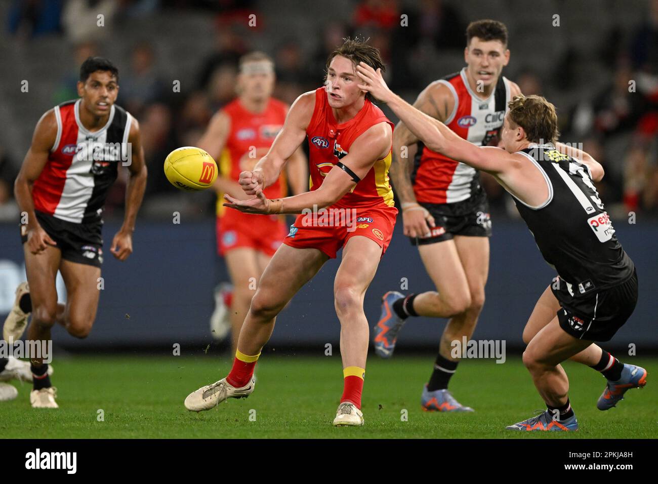 Bailey Humphrey of the Suns handballs during the AFL Round 4 match ...