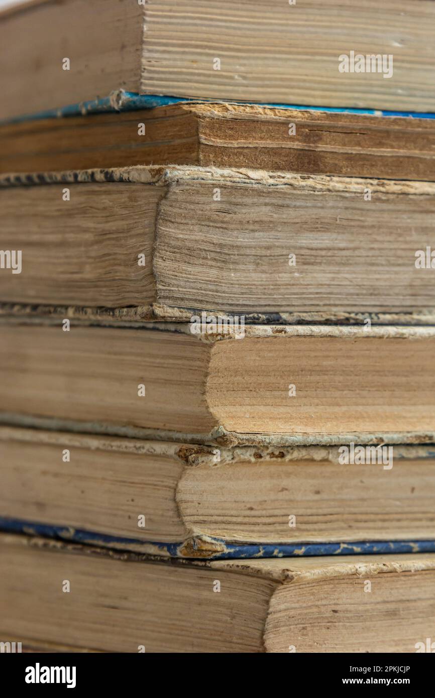 Book background. Stack of books in the library. Old yellow pages of ...