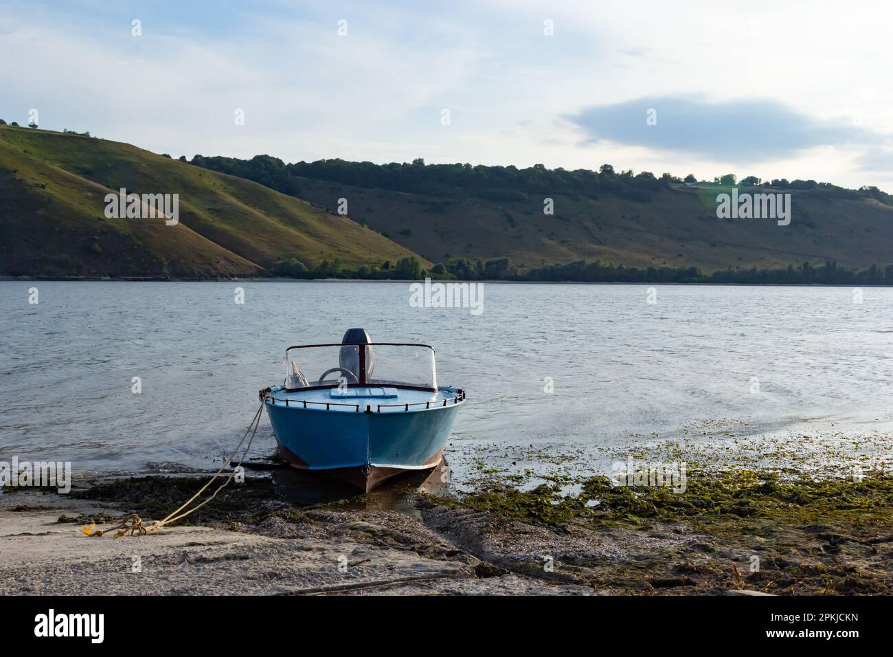 the boat stands on the bank of the river. Means of transportation on ...
