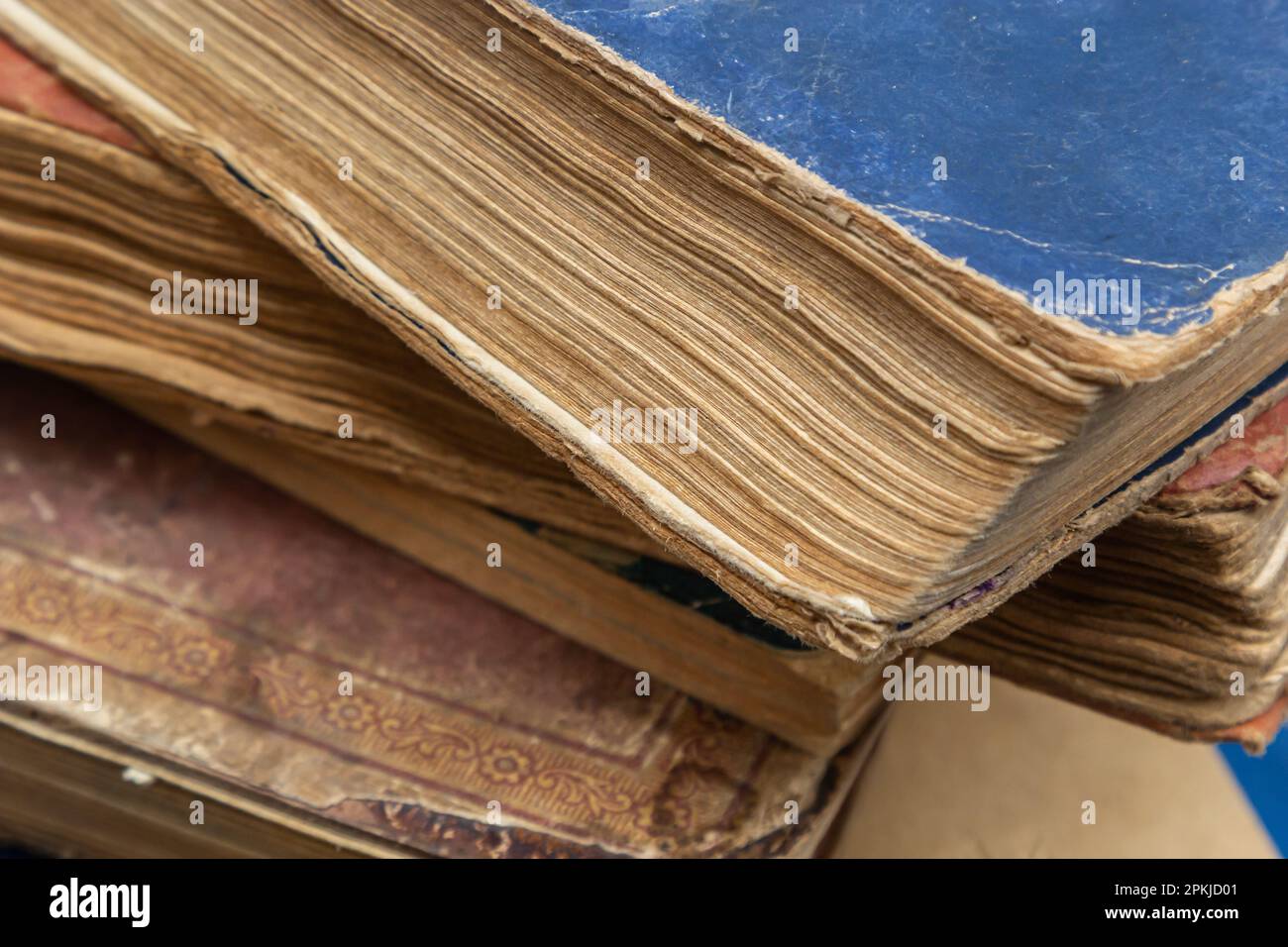 Book background. Stack of books in the library. Old yellow pages of ...
