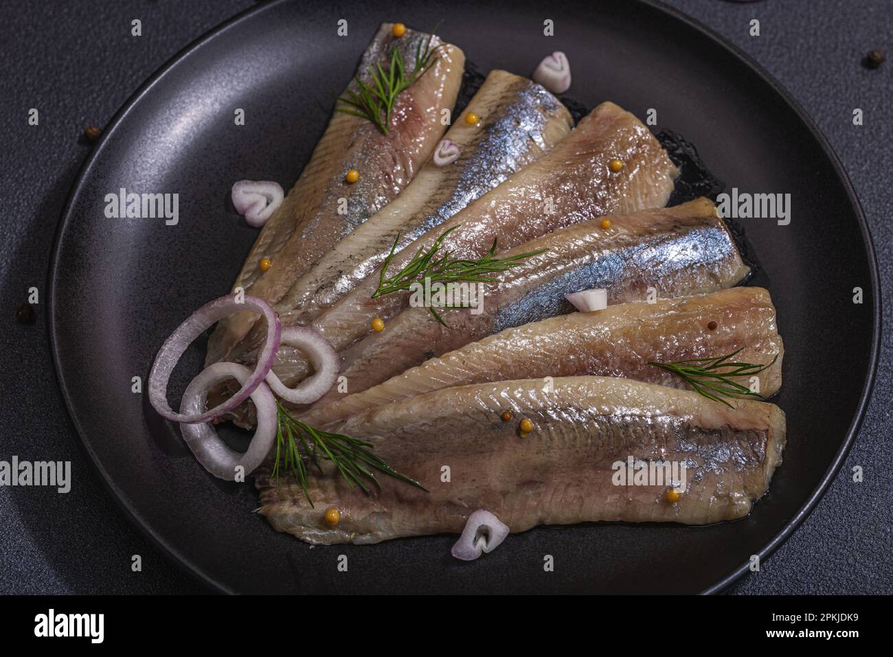 Fillet of pickled marinated sea herring fish with shallots and dill ...