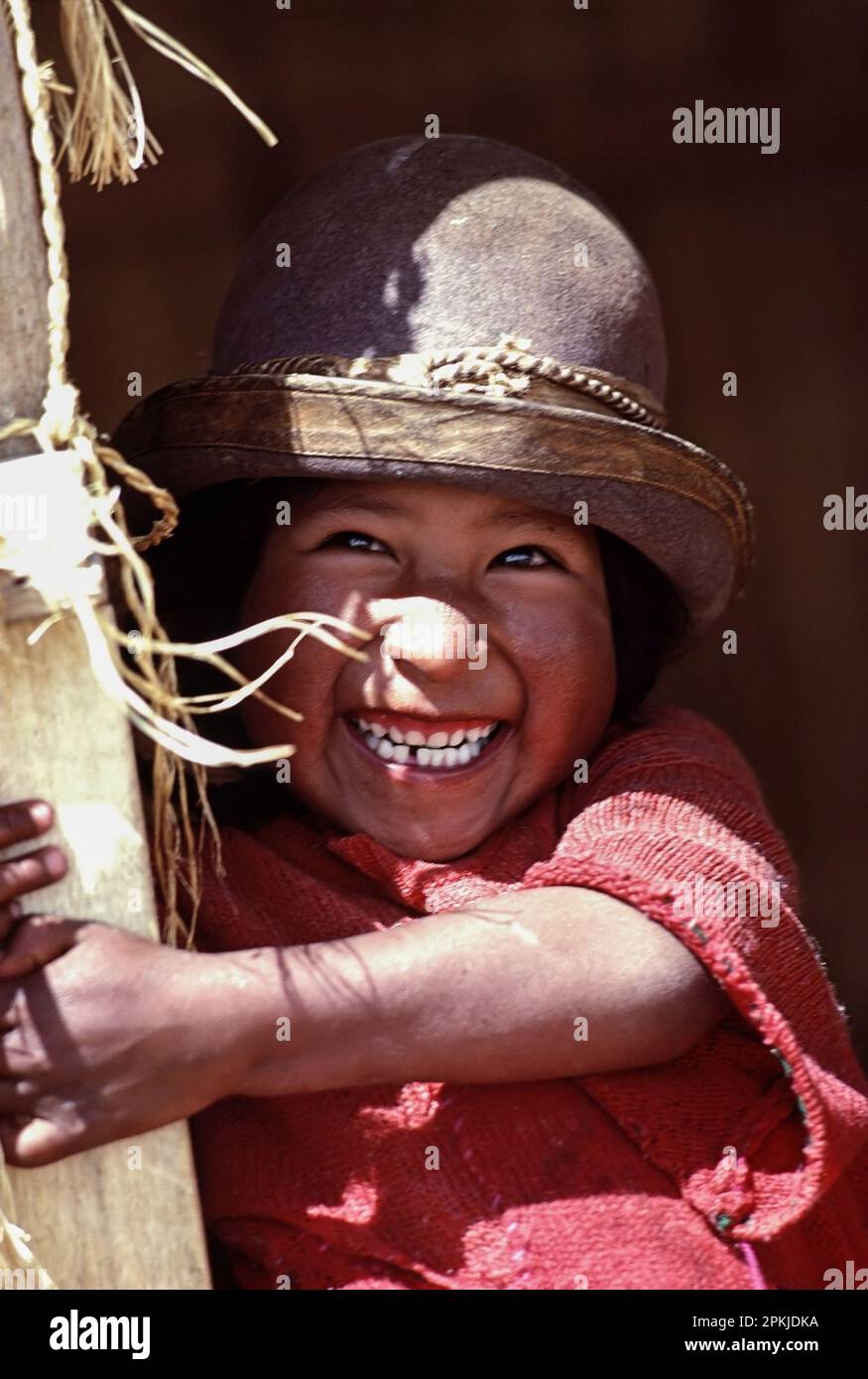 Girl on floating island on Lake Titicaca, Peru Stock Photo - Alamy