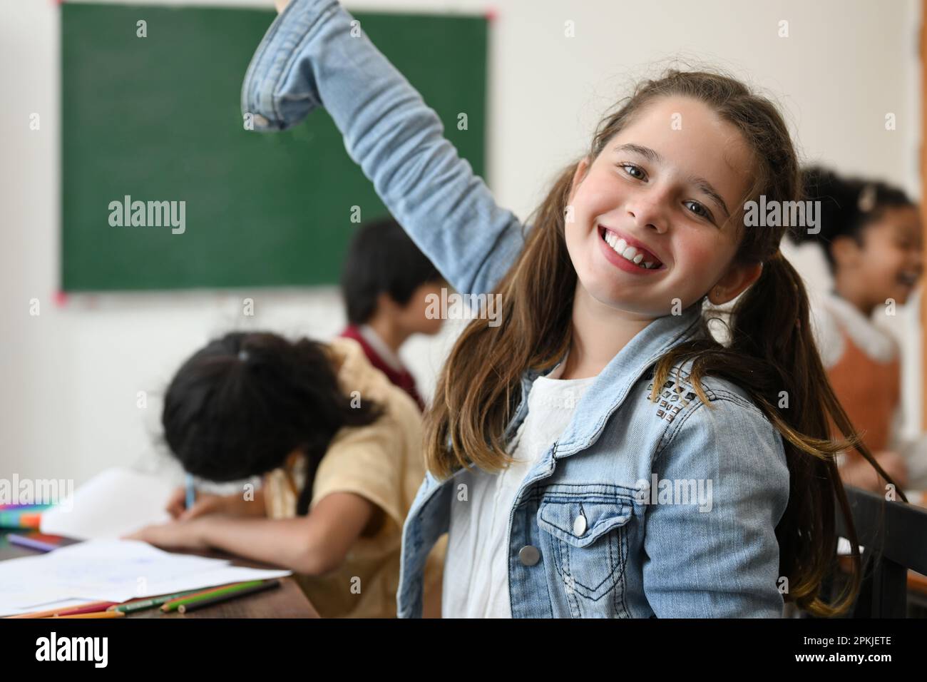 Happy junior school student looking at camera with smile Stock Photo ...