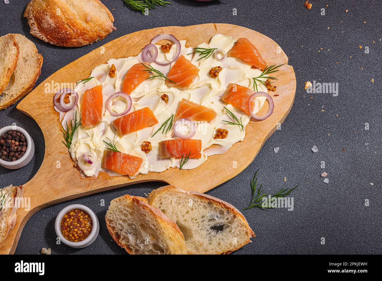 Butter Board food trend topped with salmon, shallots and fresh greens ...
