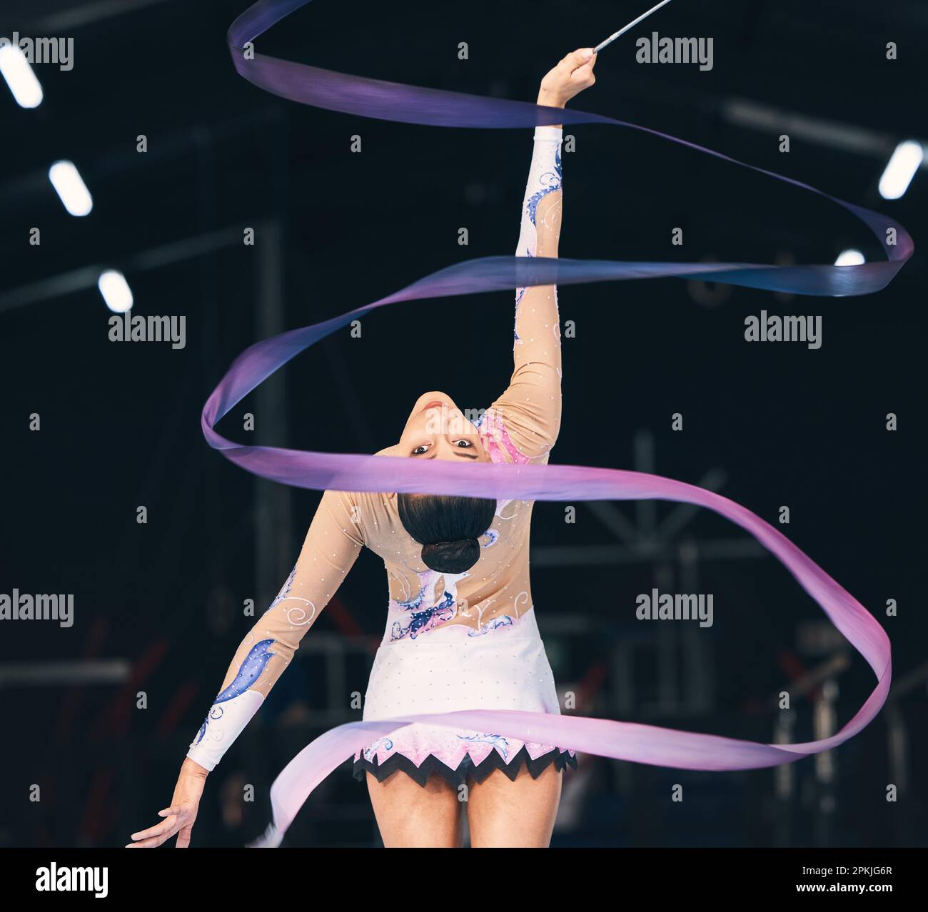 Ribbon gymnastics, flexible woman and dancing in performance, training ...