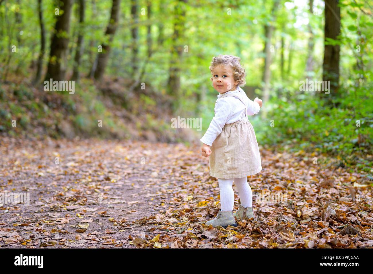 Little girl turning hi-res stock photography and images - Alamy