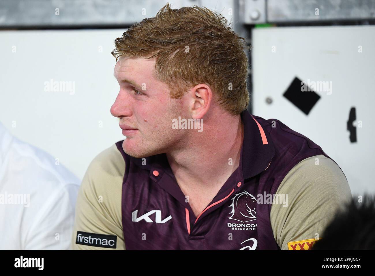 Thomas Flegler of the Broncos looks on from the bench during the NRL ...
