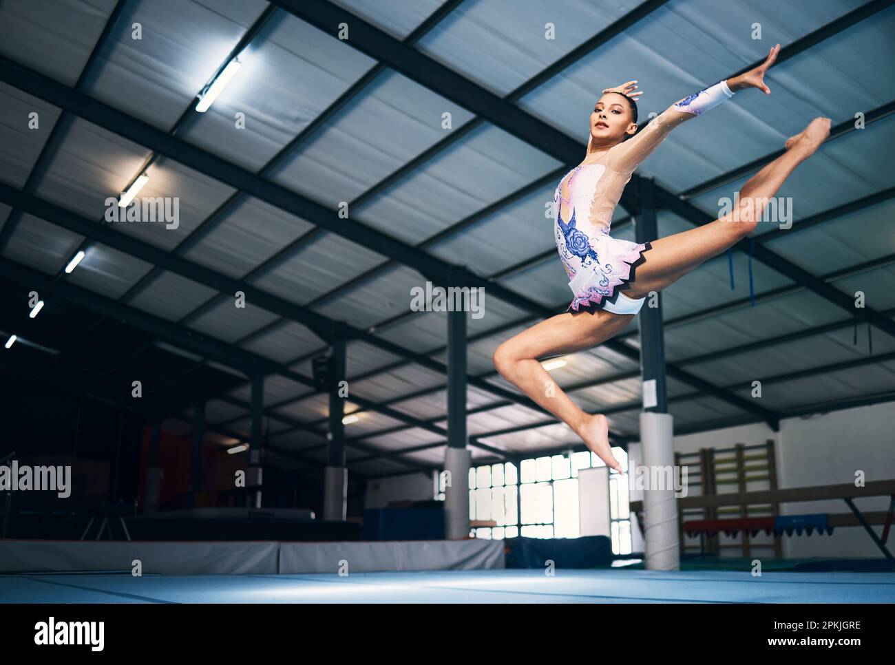 Dance, jump and a woman in gymnastics practice, artistic hobby and ...