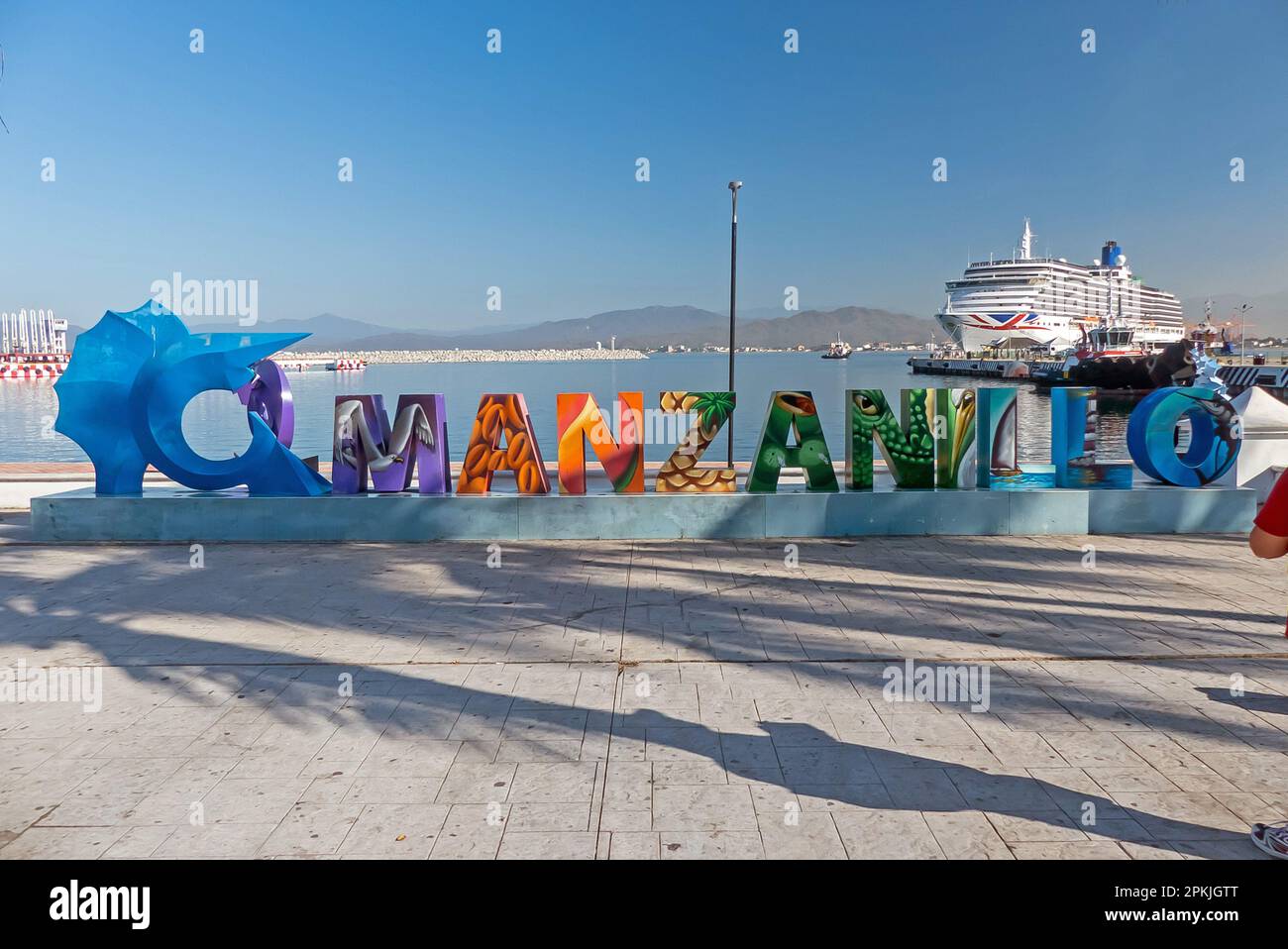 Manzanillo city name on the harbourside, with the cruise ship 'Arcadia ...
