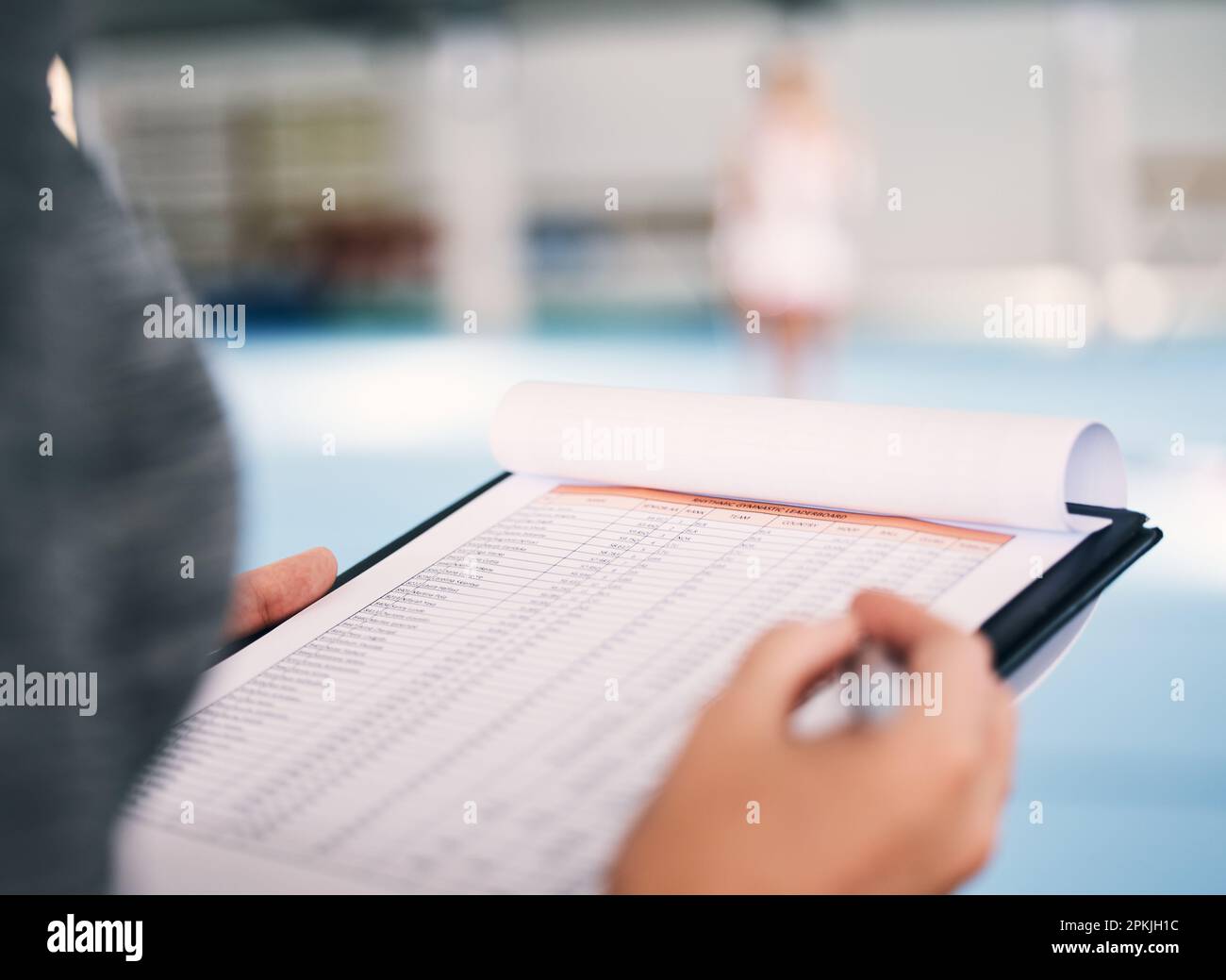 Hand, documents and assessment in a gym with a coach watching a ...