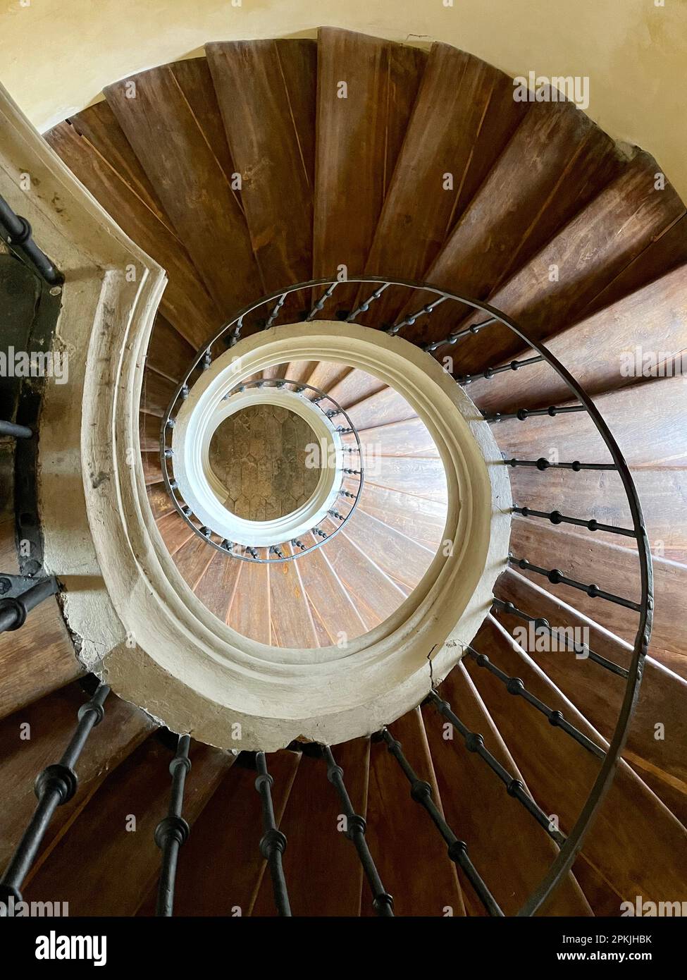A spiral staircase with wooden steps in the Church of the Assumption of ...