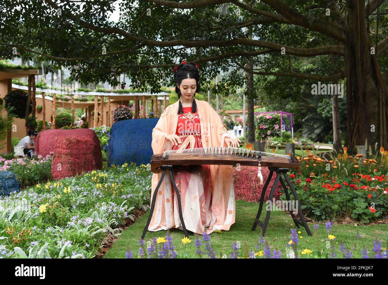 Shenzhen, China's Guangdong Province. 8th Apr, 2023. A performer plays ...