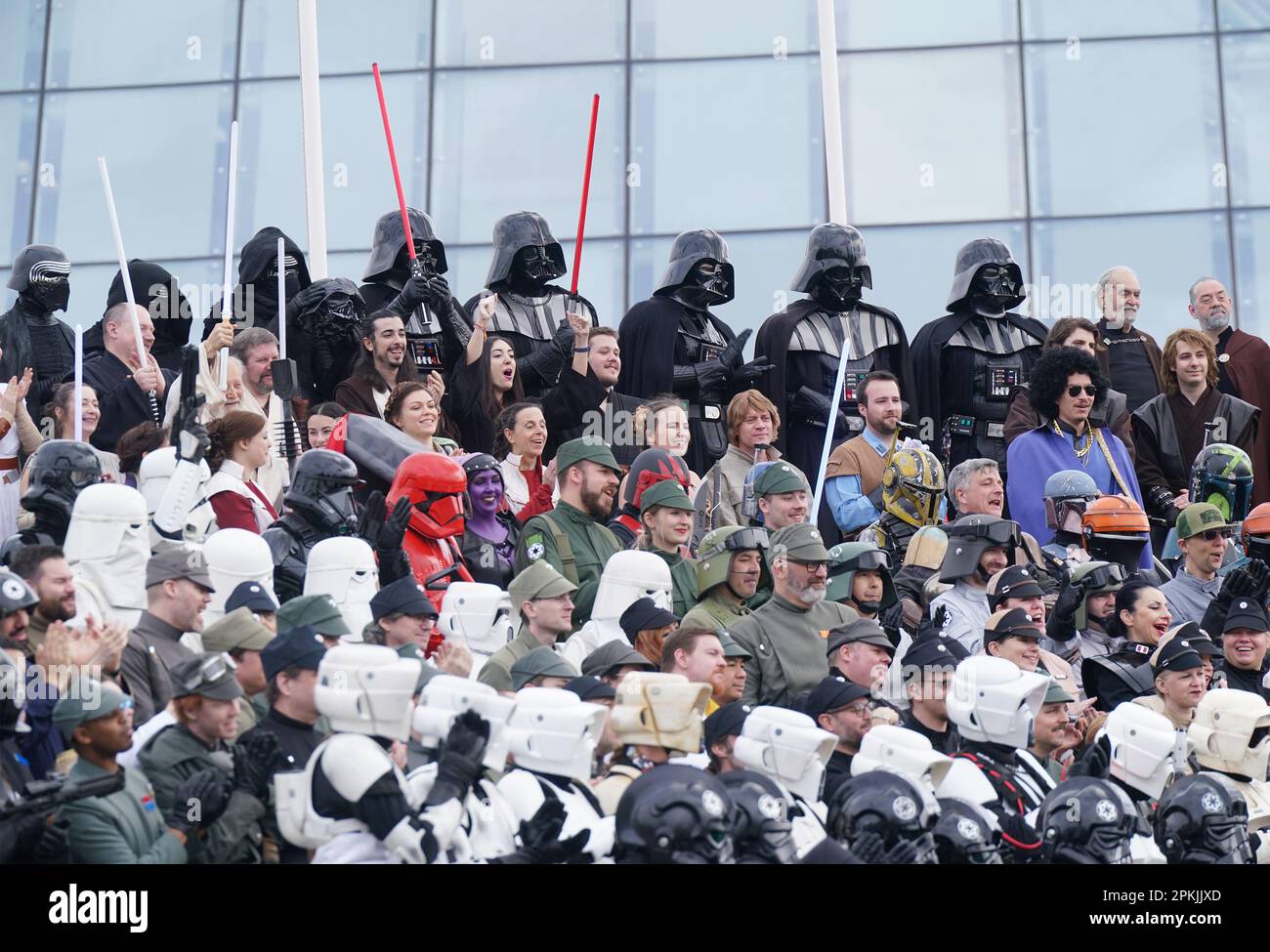 Visitors dressed in costumes pose for a group photograph during the ...