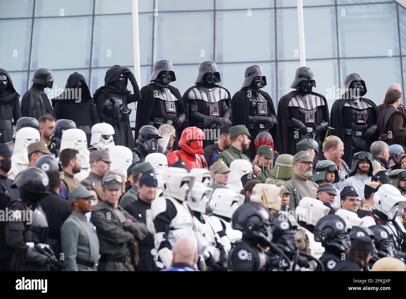 Visitors dressed in costumes pose for a group photograph during the ...