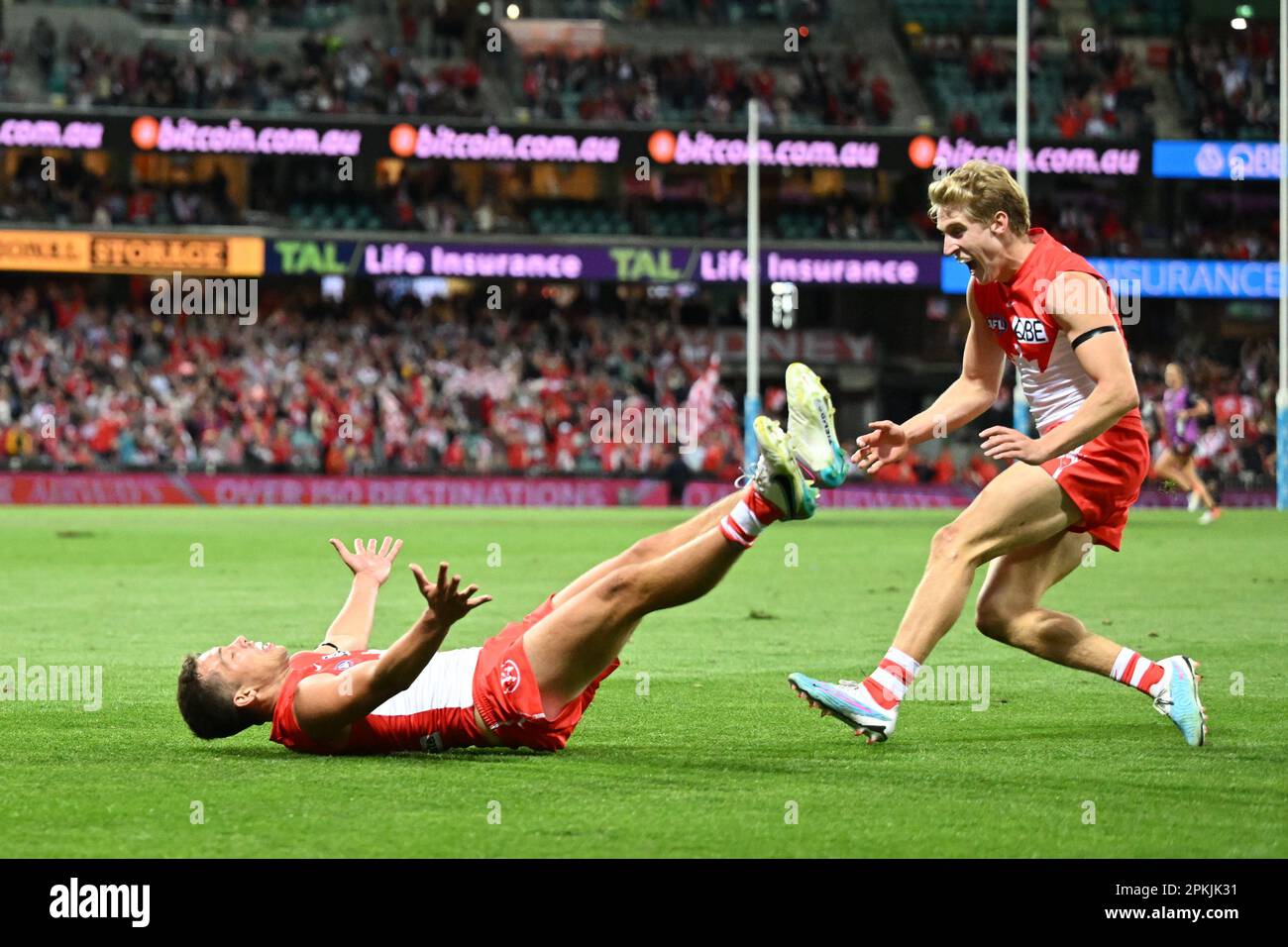 Oliver Florent and Callum Mills of the Swans celebrate prematurely as ...