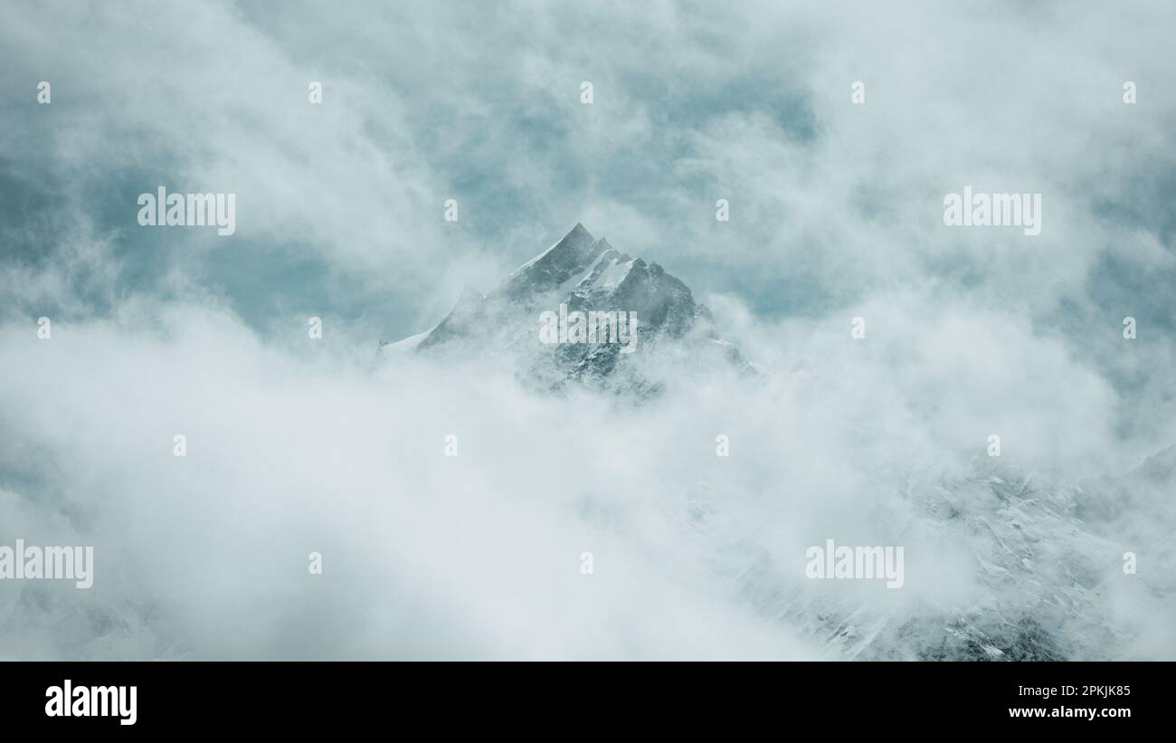 Snow mountain in clouds hi-res stock photography and images - Alamy