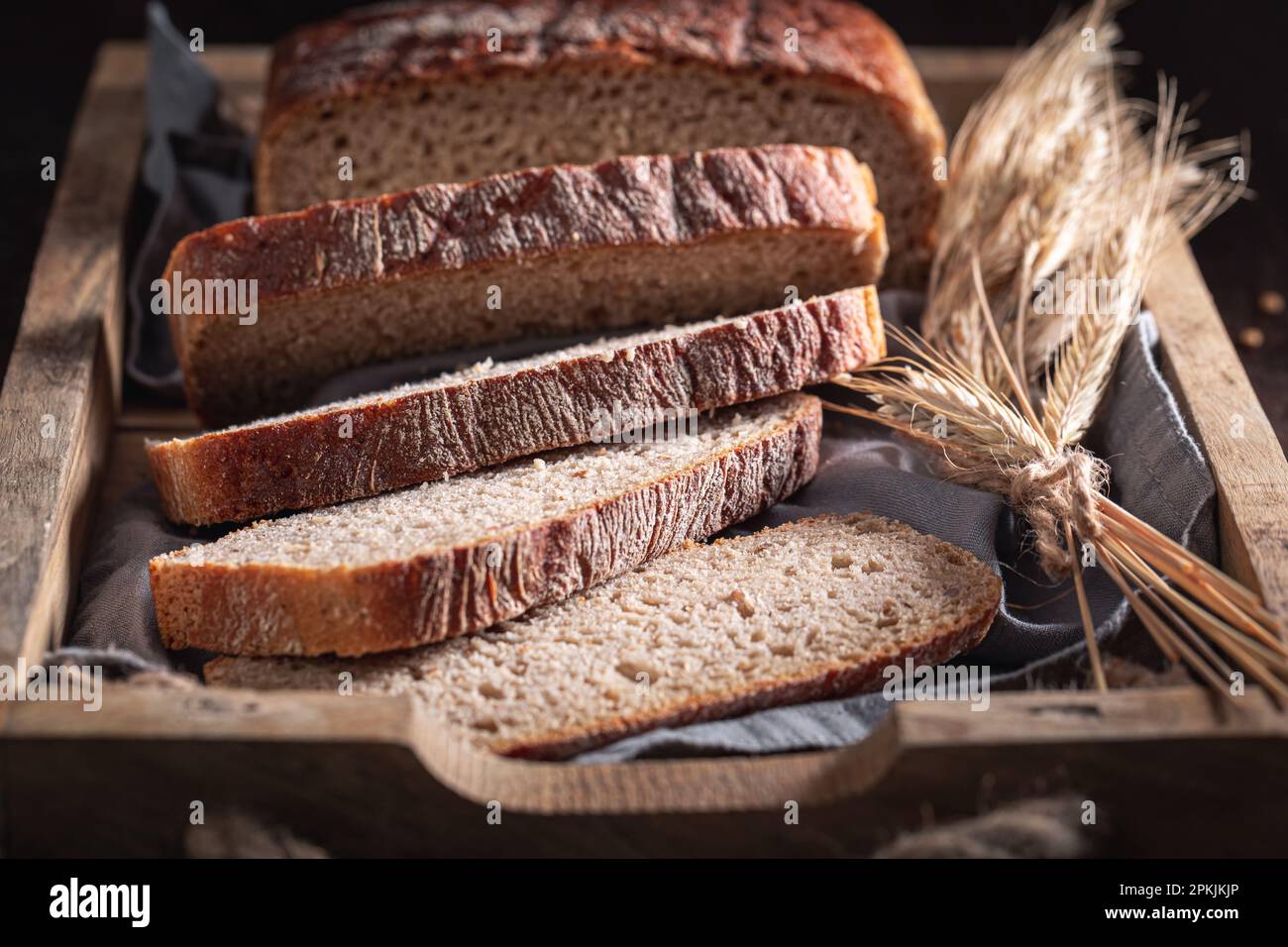 Healthy loaf of breads with grain and ears. Rustic loaves of bread ...