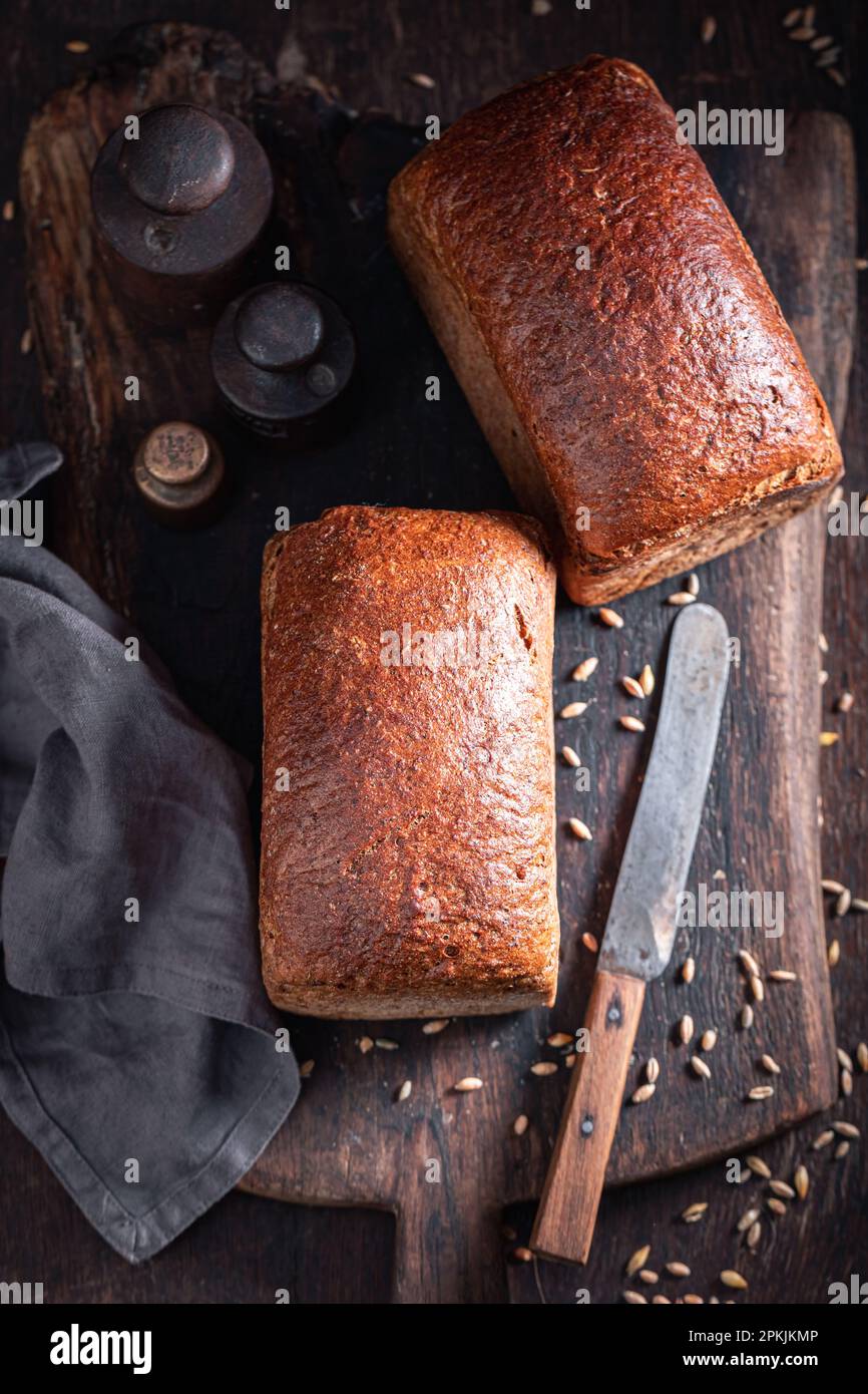 Fresh loaf of breads with grain and ears. Rustic loaves of bread Stock ...
