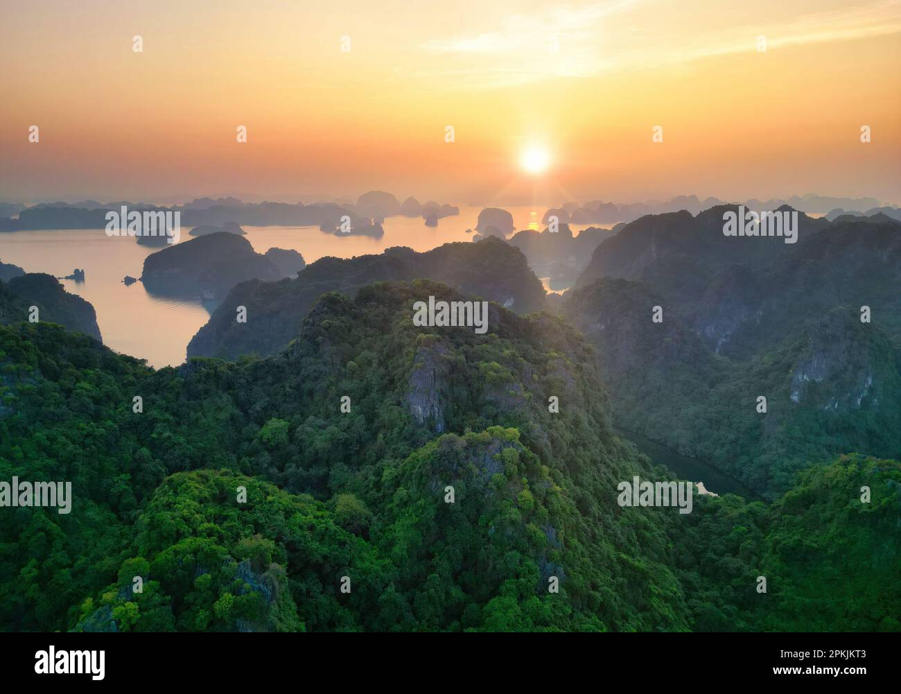 Stunning sunset of Halong Bay, Bai Tu Long Bay in Vietnam Stock Photo ...