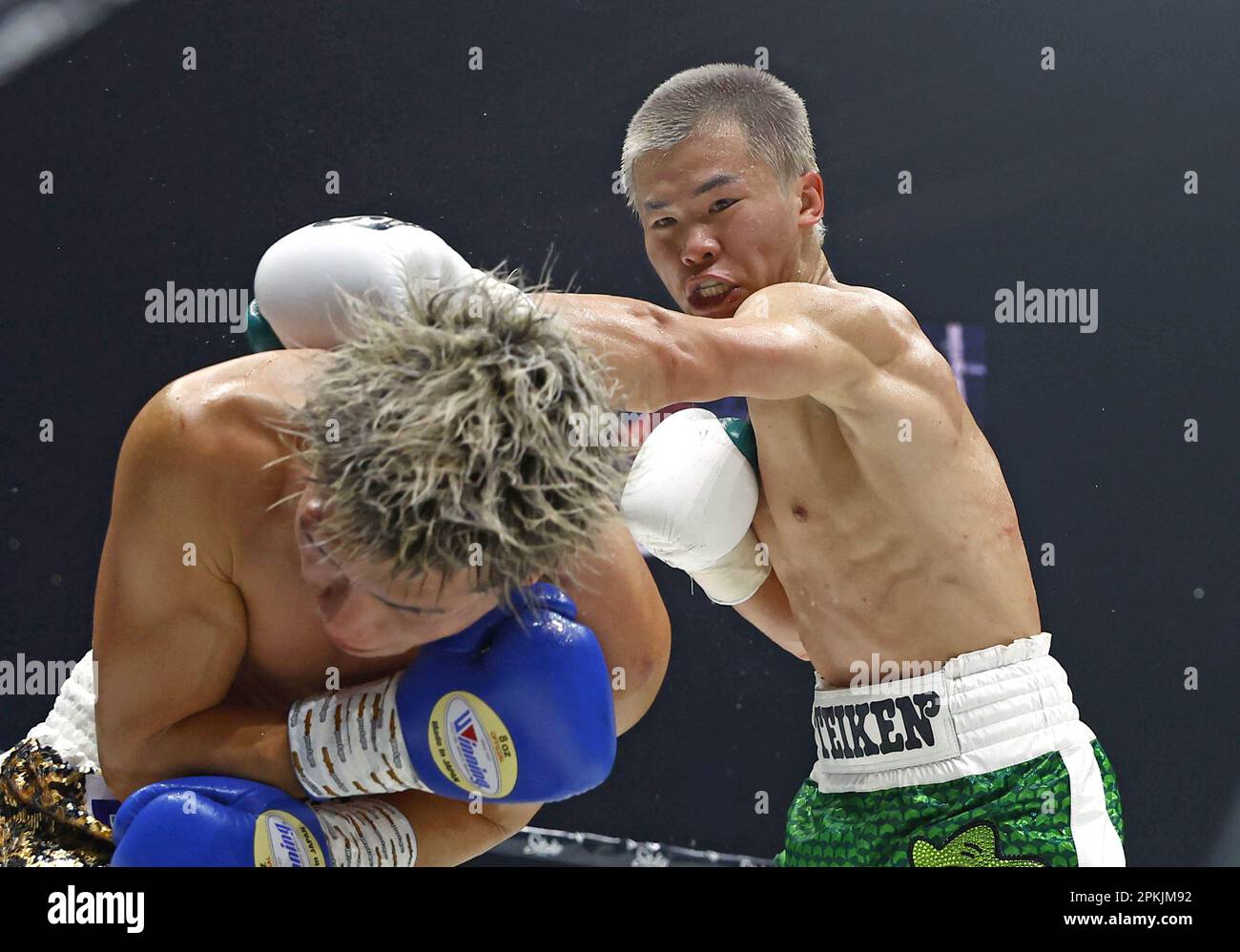 Tenshin Nasukawa (R) punches Yuki Yonaha in a super bantamweight six-rounder at Tokyo's Ariake ...