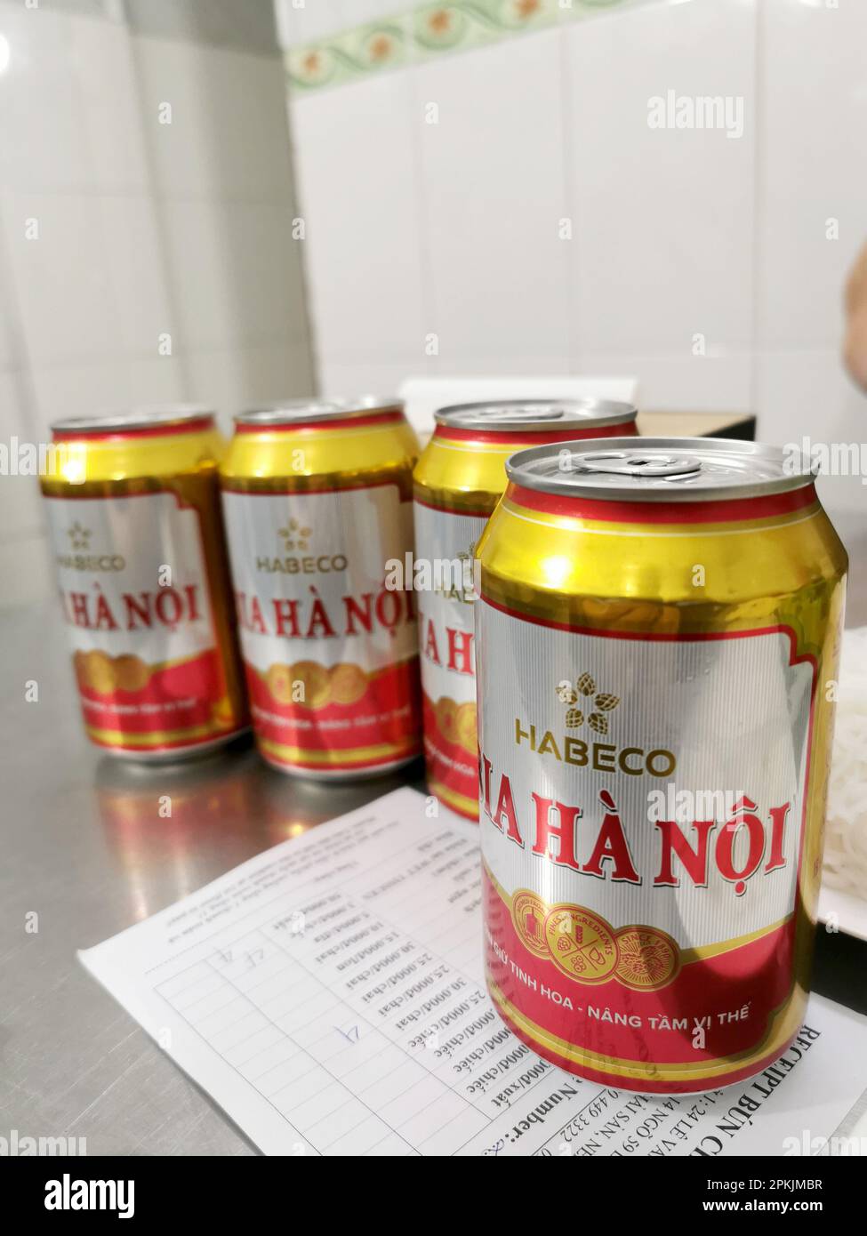26 February 2023, Vietnam, Hanoi: Cans of Hanoi brand beer are on a ...