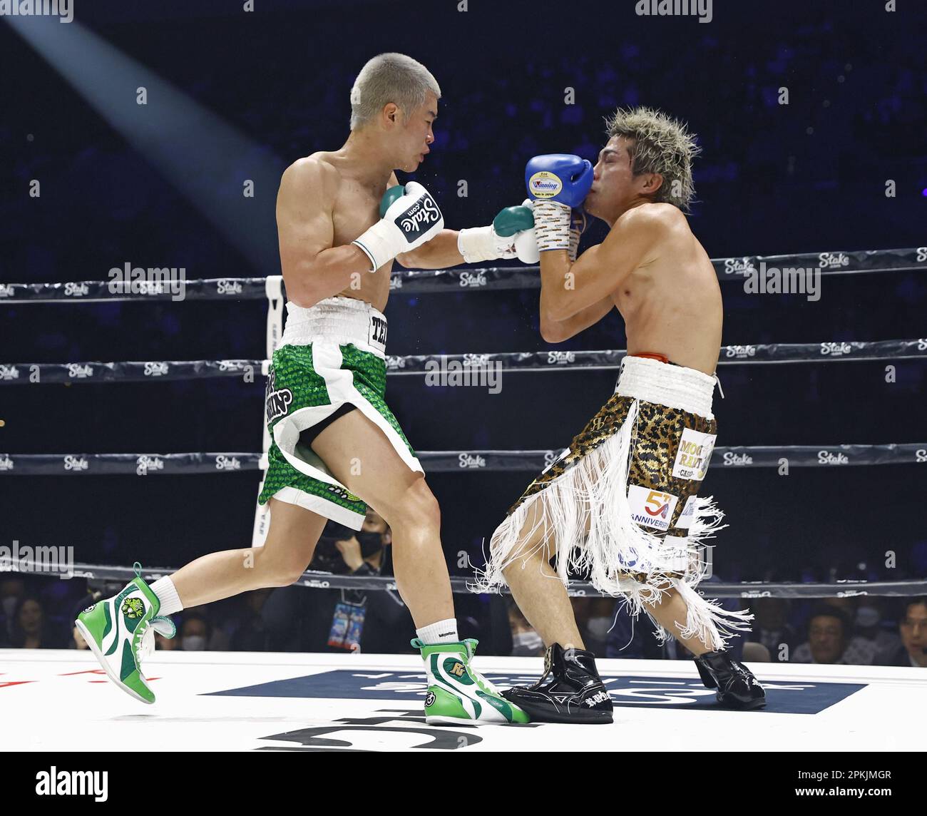 Tenshin Nasukawa (L) punches Yuki Yonaha in a super bantamweight six-rounder at Tokyo's Ariake ...