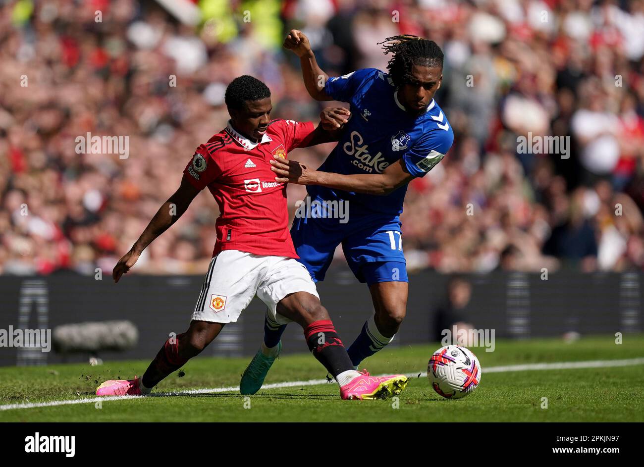 Manchester United's Tyrell Malacia battles for the ball with Everton’s ...