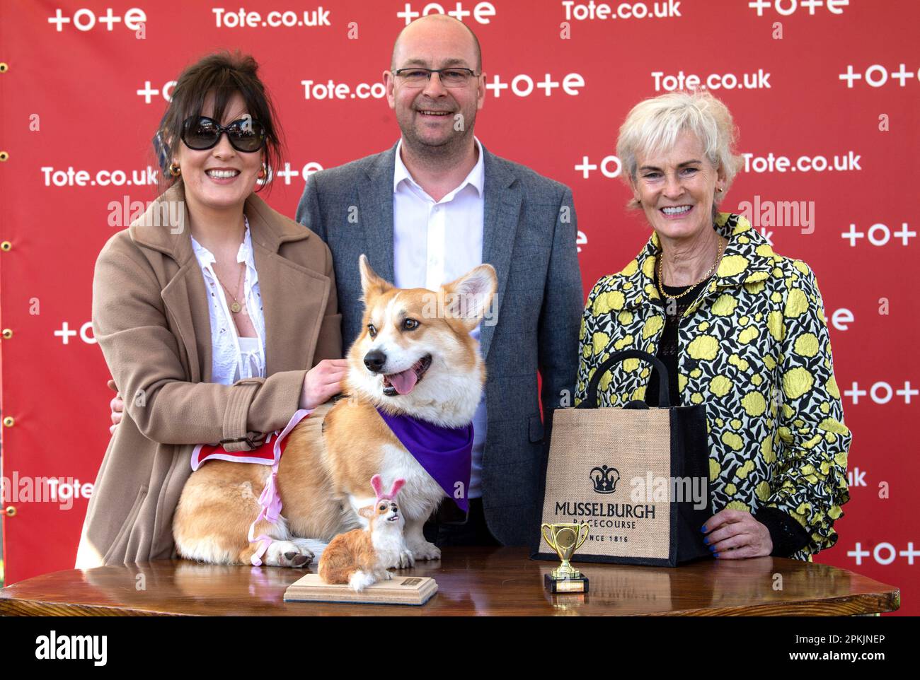 Winner of the Corgi Derby Rodney alongside his owners Matt Kendall and ...