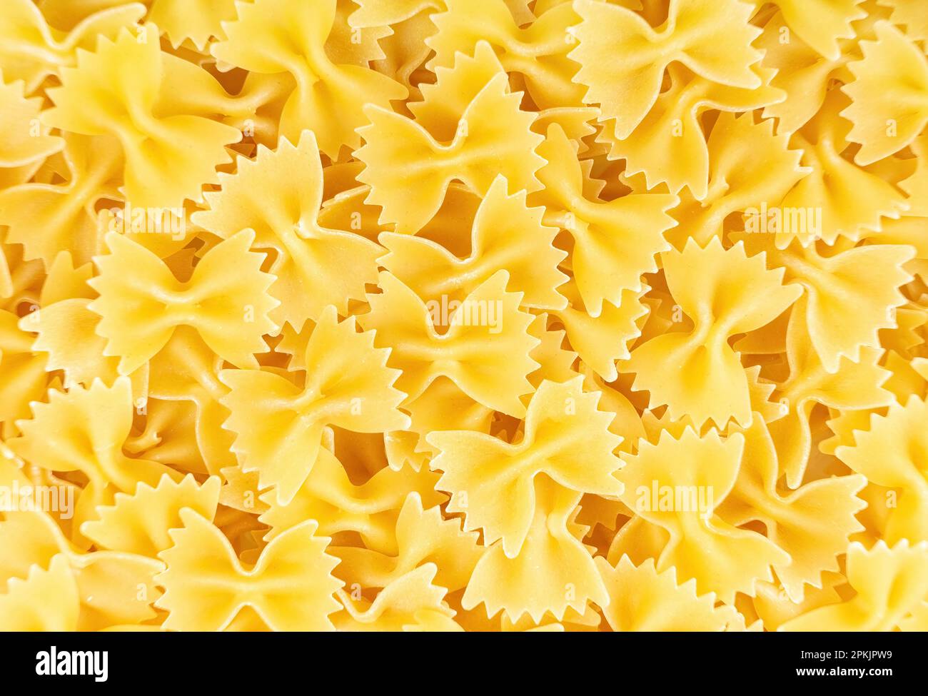 Farfalle spaghetti pattern, food background. Raw pasta, ingredient for ...