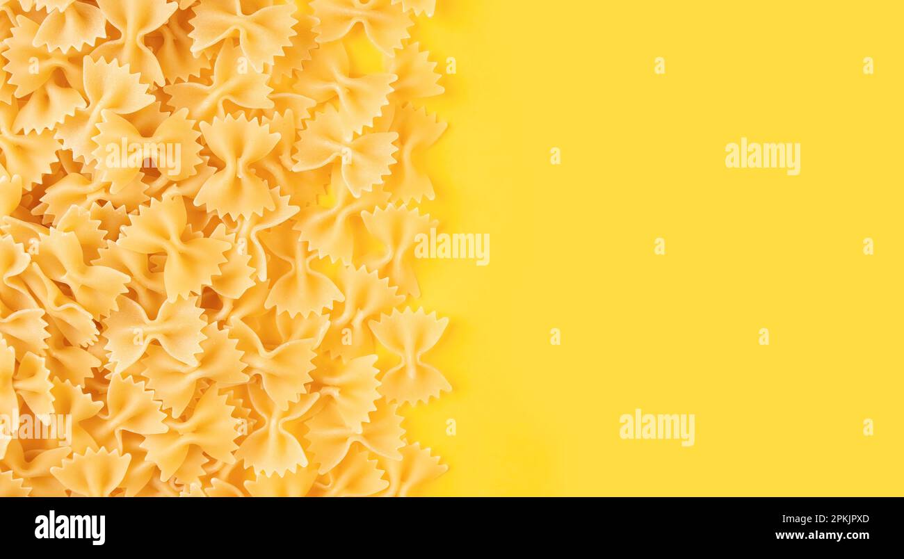 Farfalle spaghetti pattern, food background. Scattered raw pasta ...