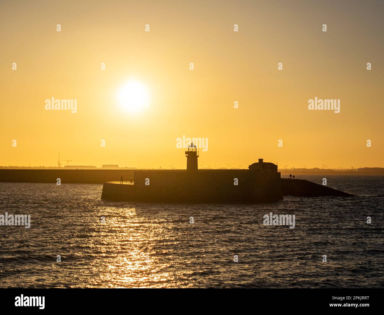 Golden hour sunset over Dún Laoghaire Lighthouse Stock Photo - Alamy