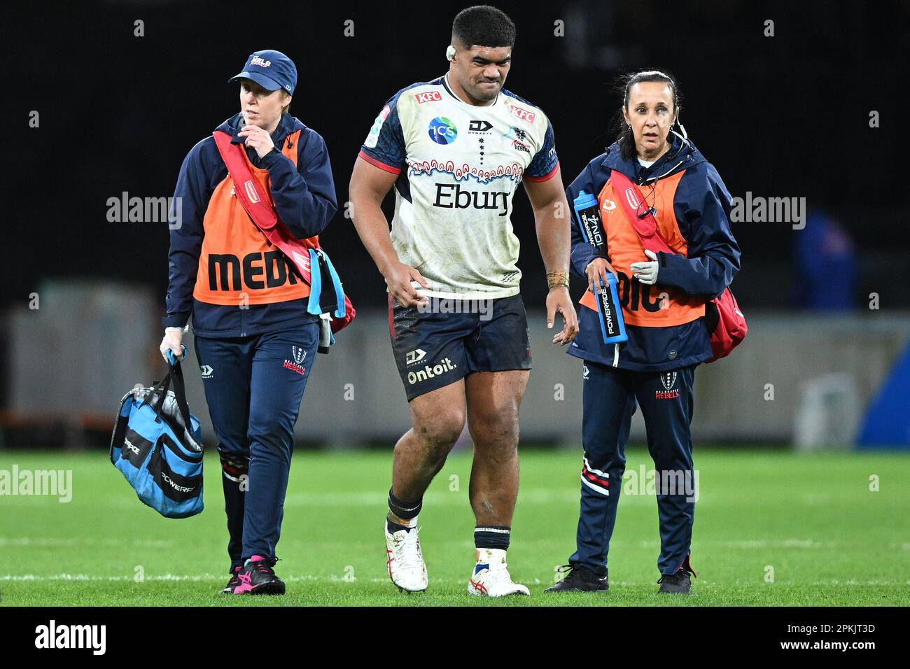 Jordan Uelese of the Rebels with medical staff during the Super Rugby ...