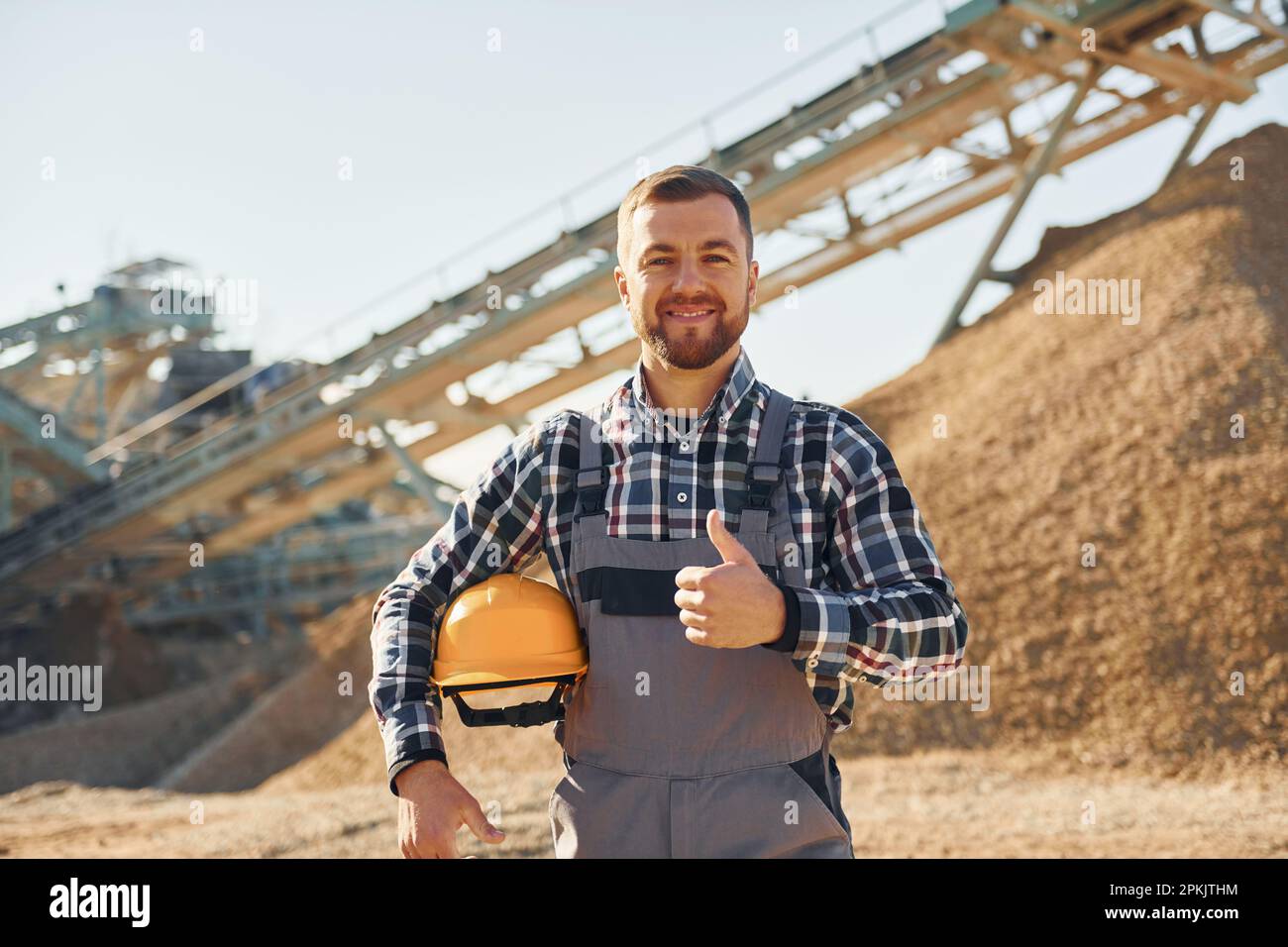 Smart person. Construction worker in uniform is on the quarry Stock ...